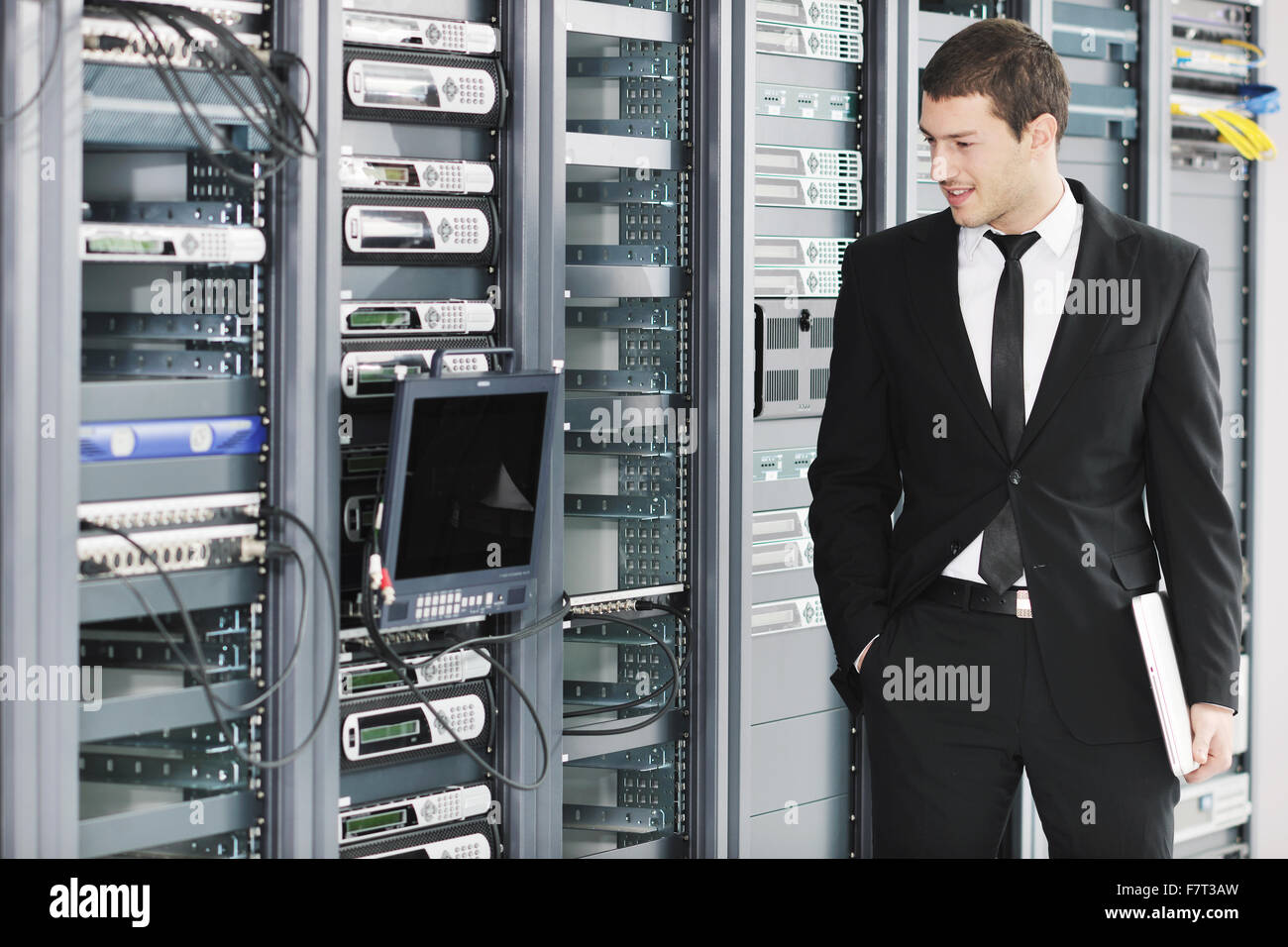 young handsome business man it engeneer in datacenter server room Stock ...