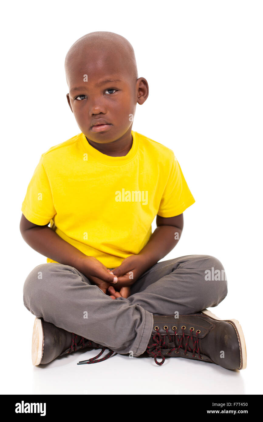 sad African American boy sitting on white background Stock Photo - Alamy