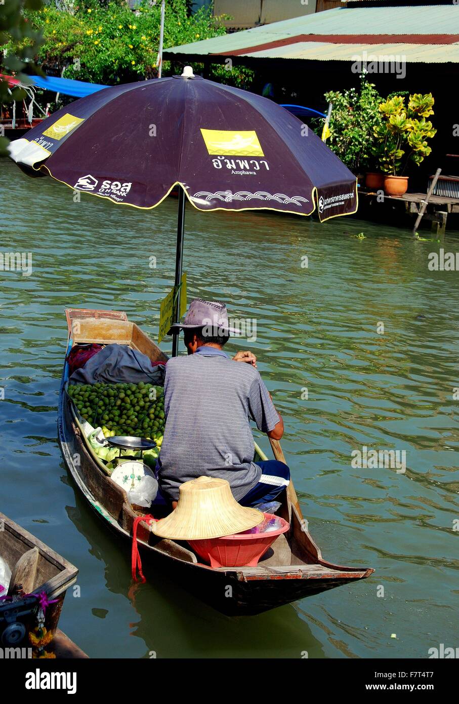 Amphawa, Thailand: Boat vendor steers his wooden boat filled with ...