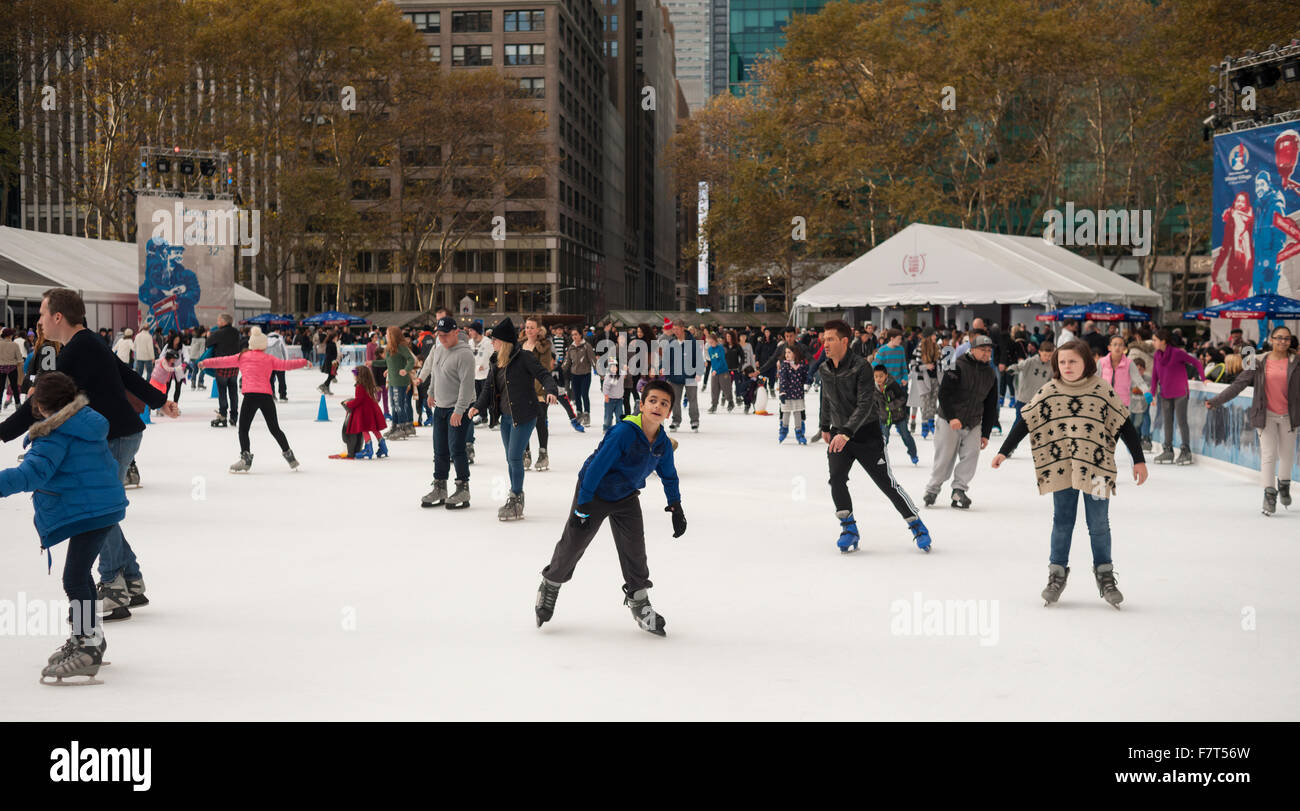 Skaters maneuver the packed Winter Village ice skating rink at Bryant ...