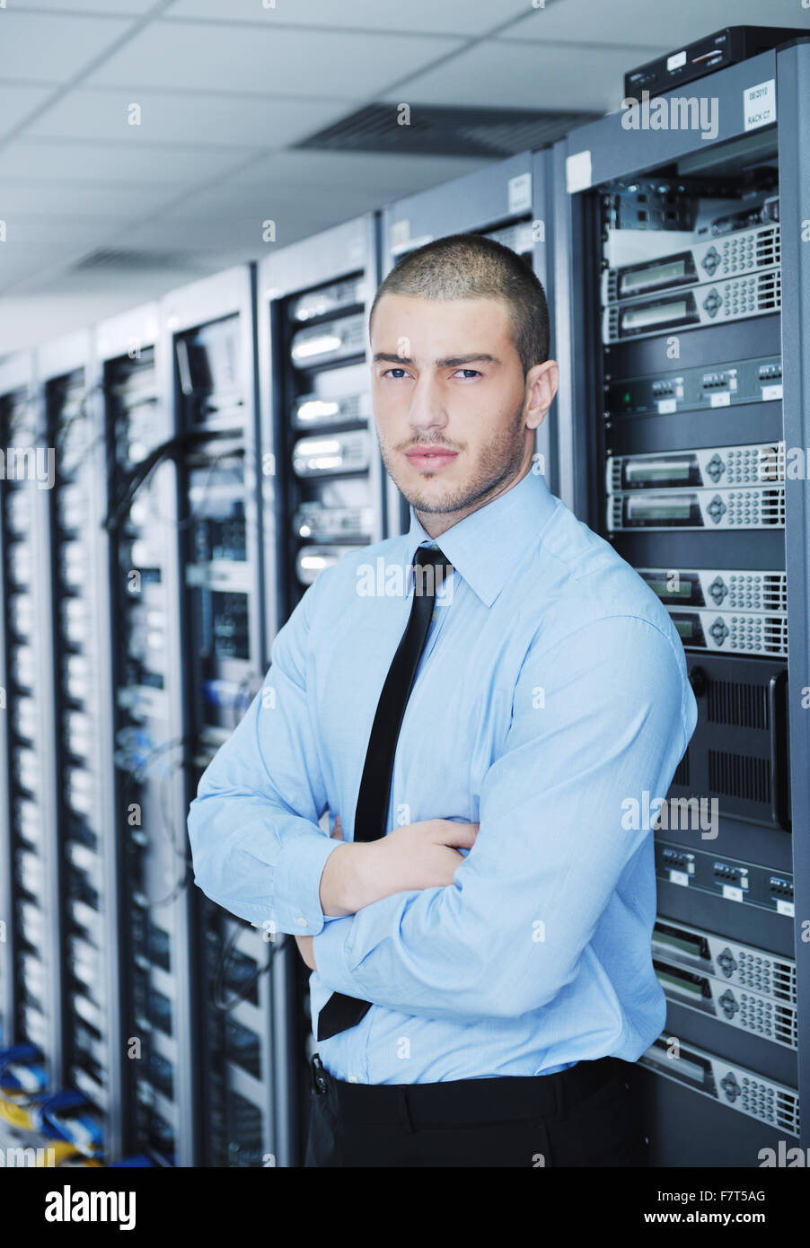 young handsome business man engineer in datacenter server room Stock ...