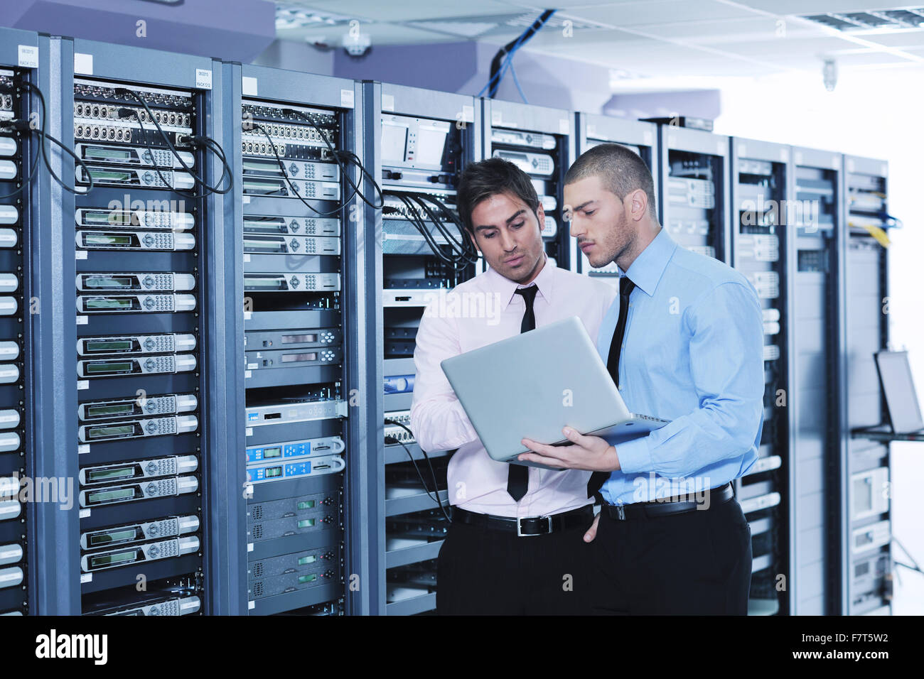 group of young business people it engineer in network server room ...