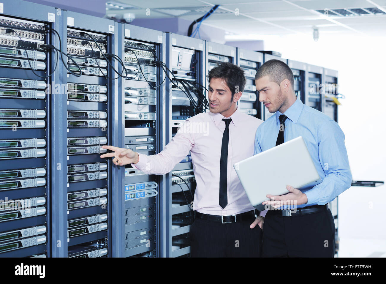 group of young business people it engineer in network server room ...