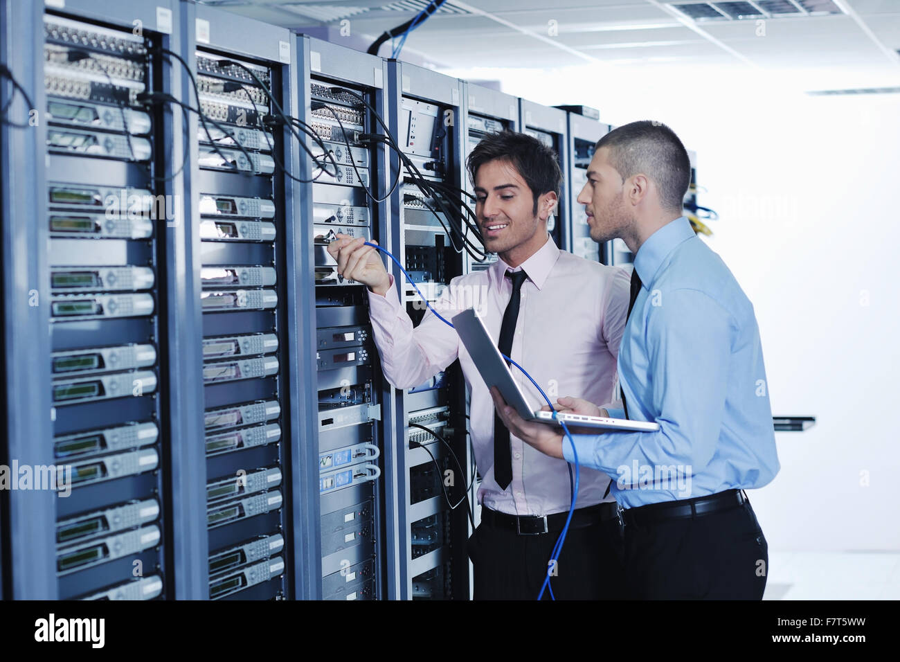 group of young business people it engineer in network server room ...