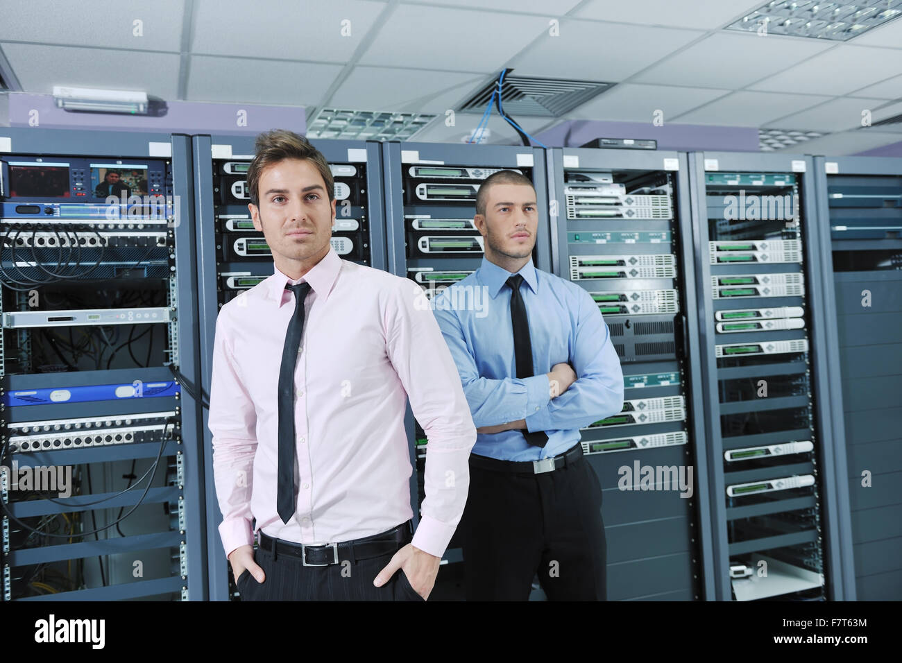 group of young business people it engineer in network server room ...