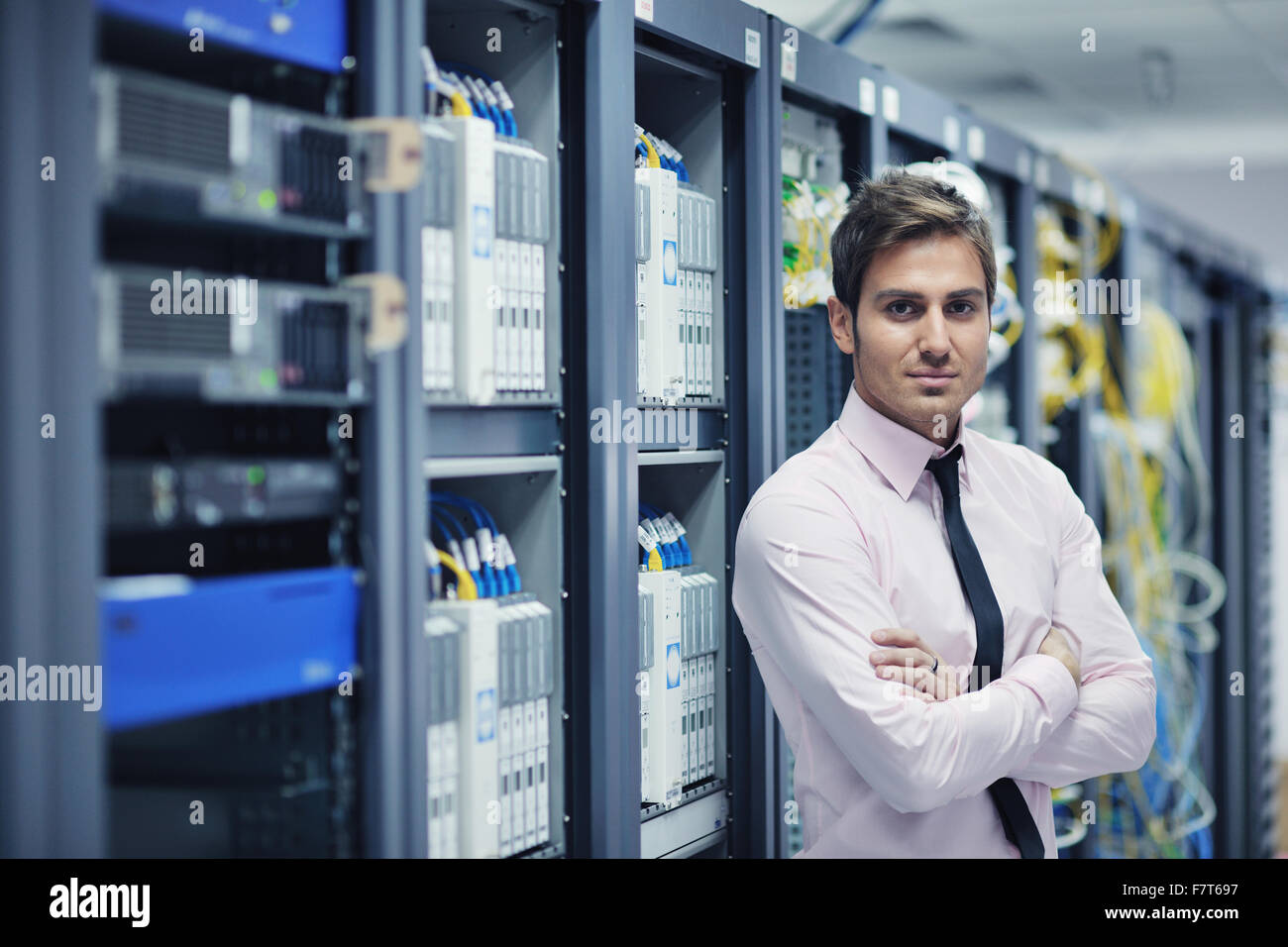 young handsome business man engeneer in datacenter server room Stock ...