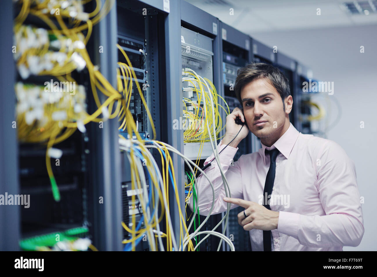young business man computer science engeneer talking by cellphone at ...