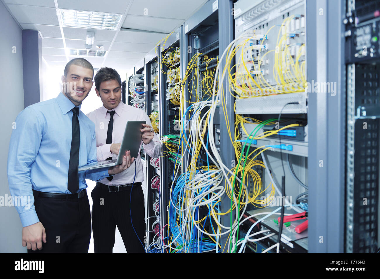 group of young business people it engineer in network server room ...