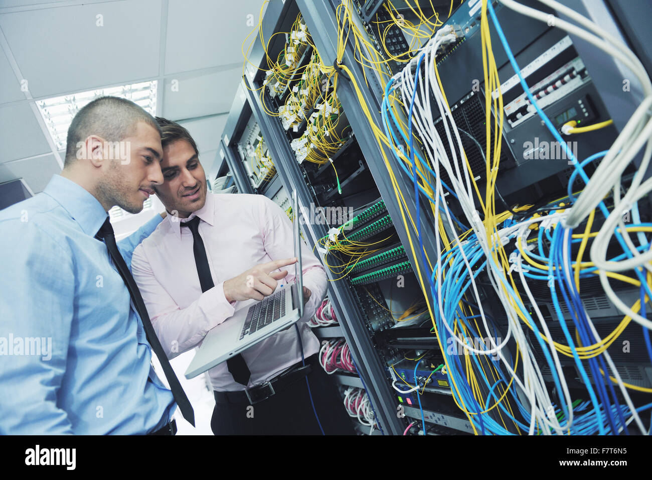 group of young business people it engineer in network server room ...