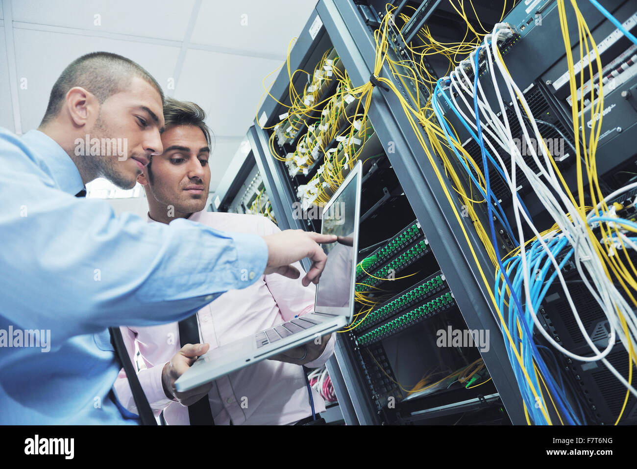 group of young business people it engineer in network server room ...