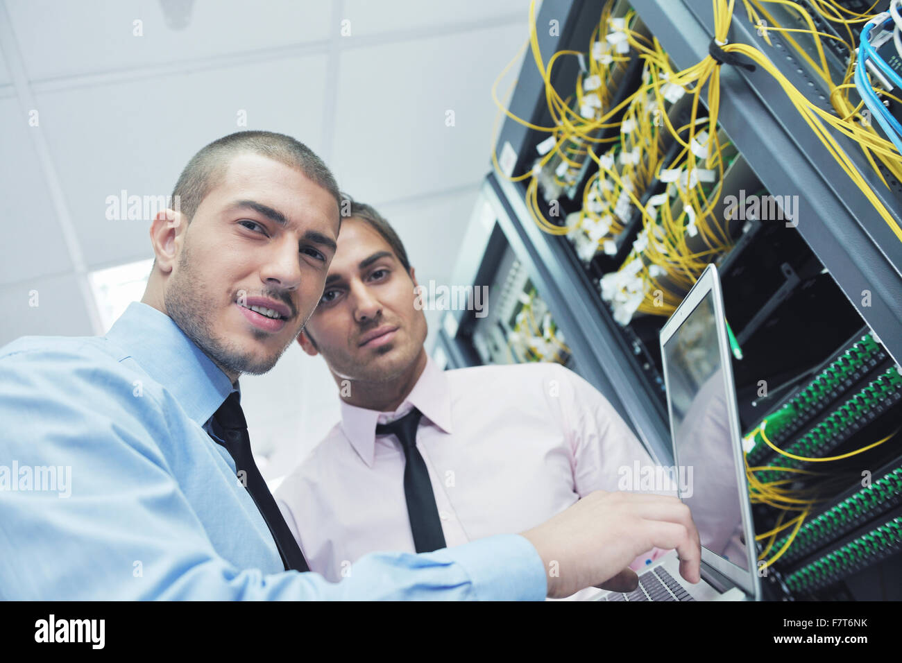 group of young business people it engineer in network server room ...