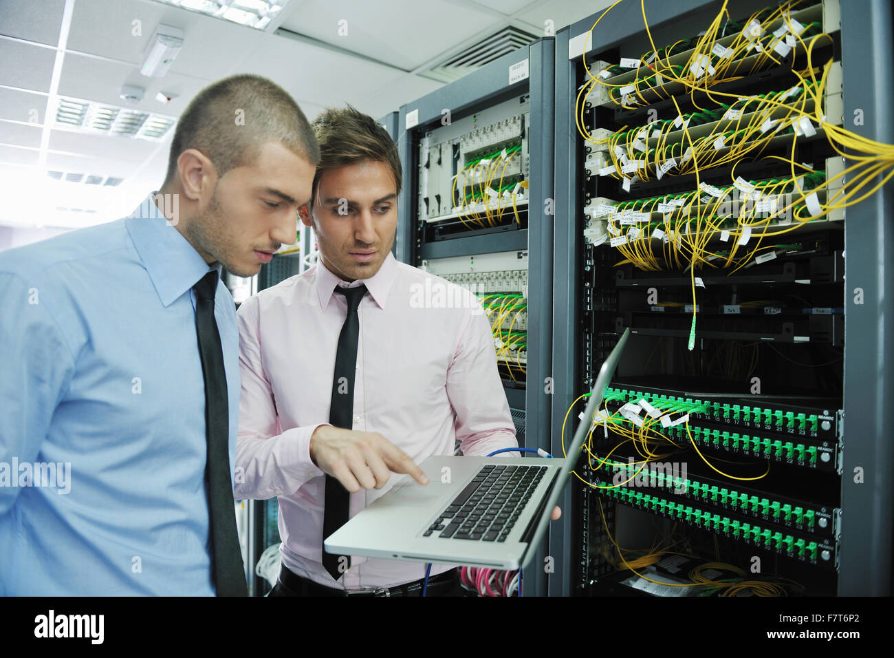 group of young business people it engineer in network server room ...