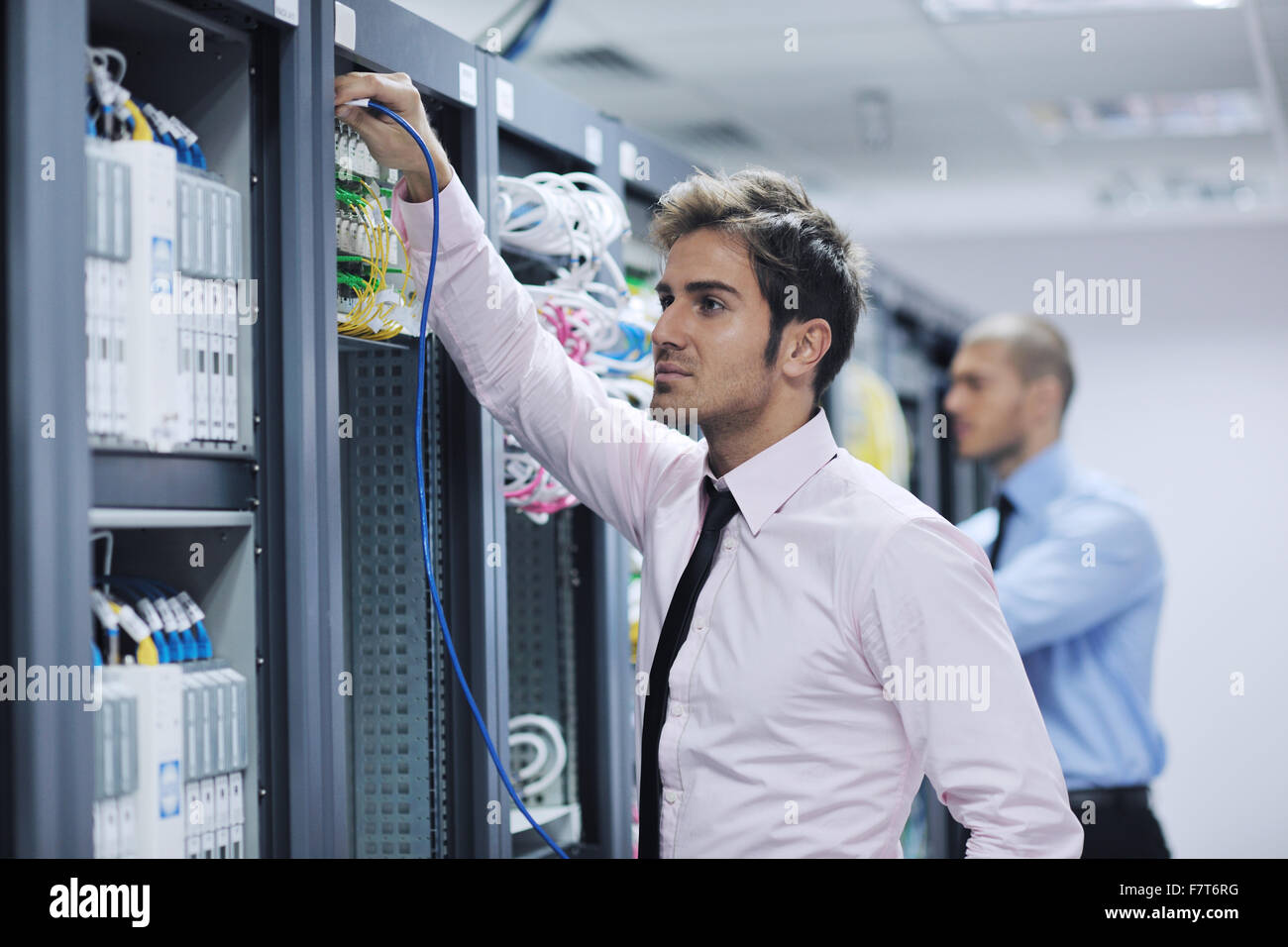 group of young business people it engineer in network server room ...