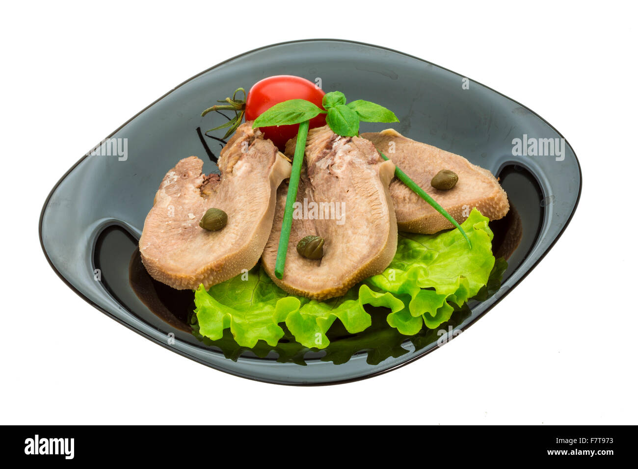 Beef tongue with herbs isolated Stock Photo - Alamy