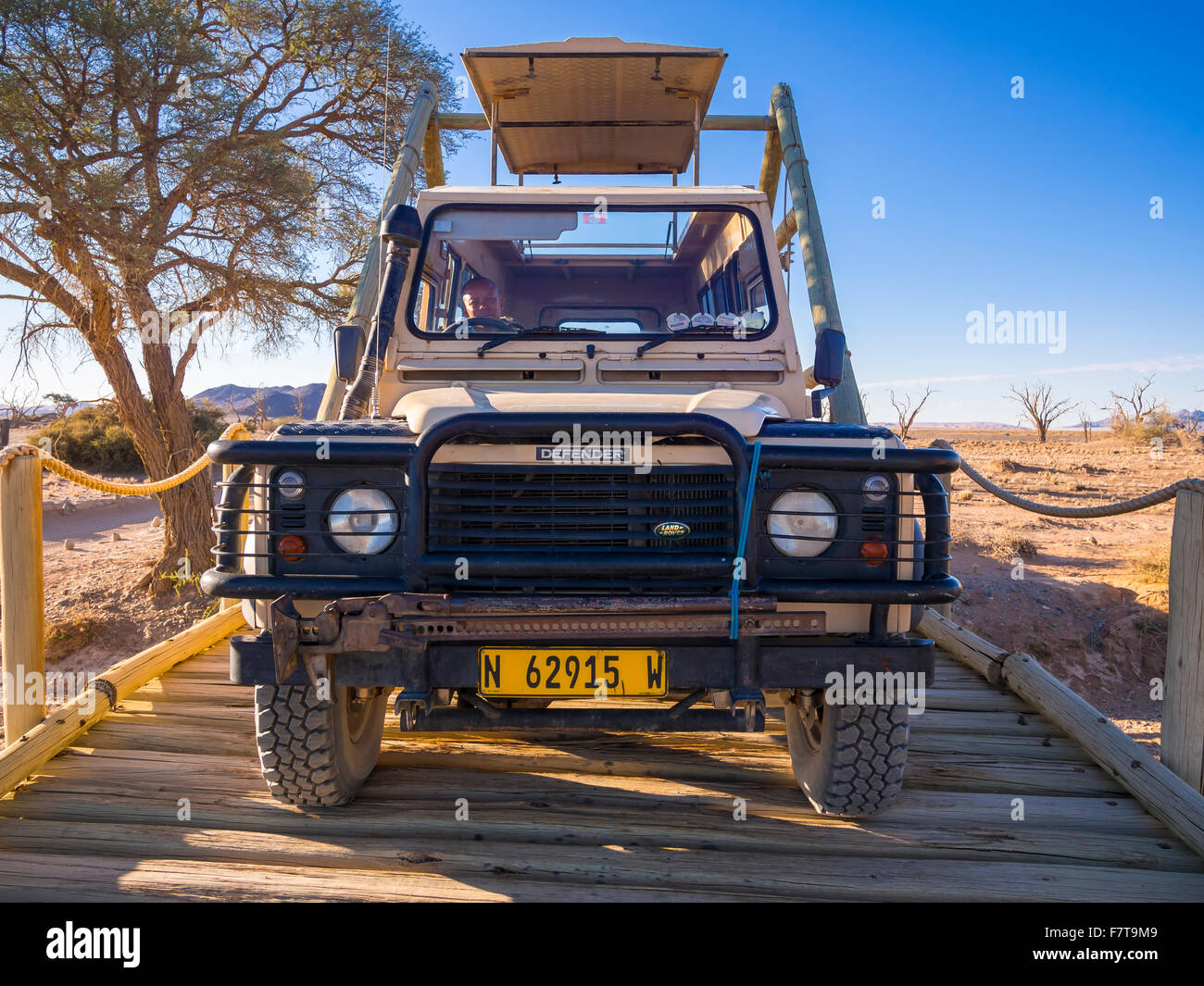 Land Rover crossing a wooden bridge in the Kulala Wilderness Reserve on ...