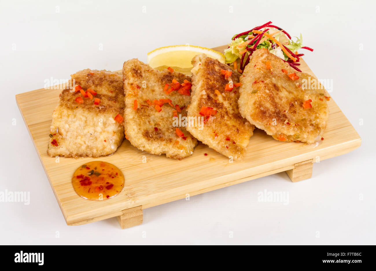 Fried fish fillets with salad Stock Photo - Alamy