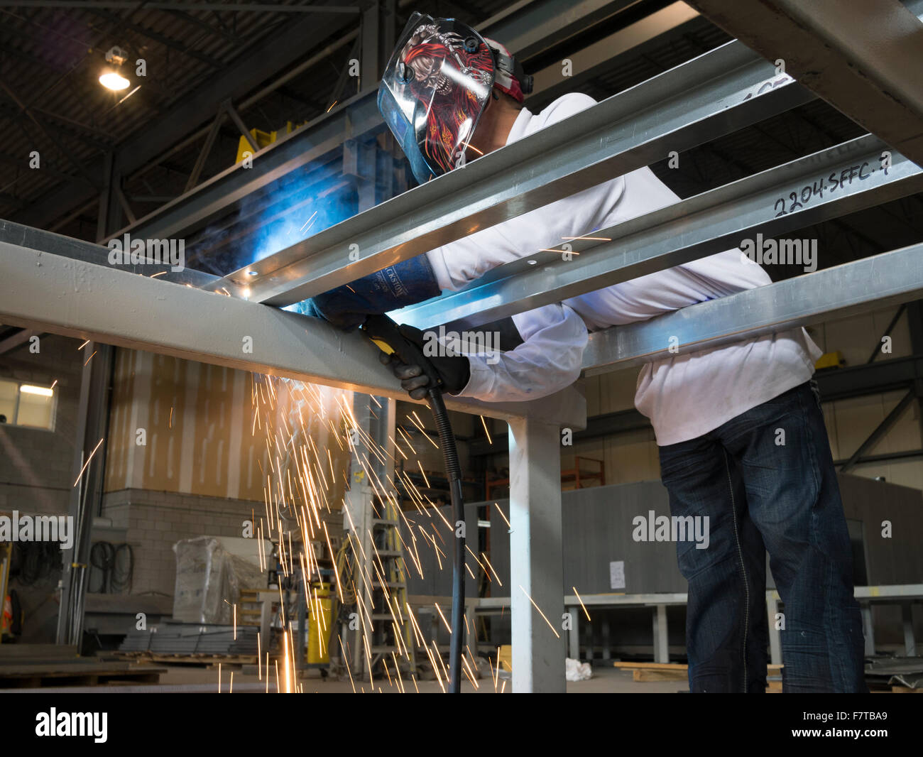 Worker welding metal frames in HVAC manufacturing factory Stock Photo ...
