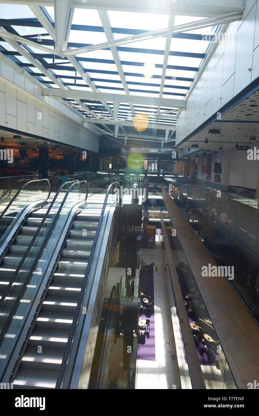 modern shopping mall store interior escalator with lens flare Stock ...