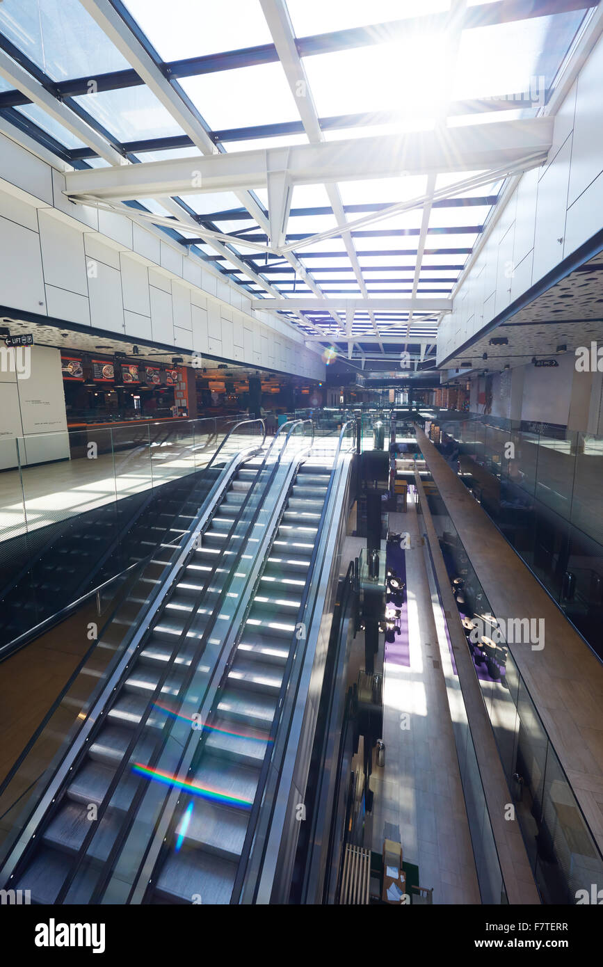 modern shopping mall store interior escalator with lens flare Stock ...