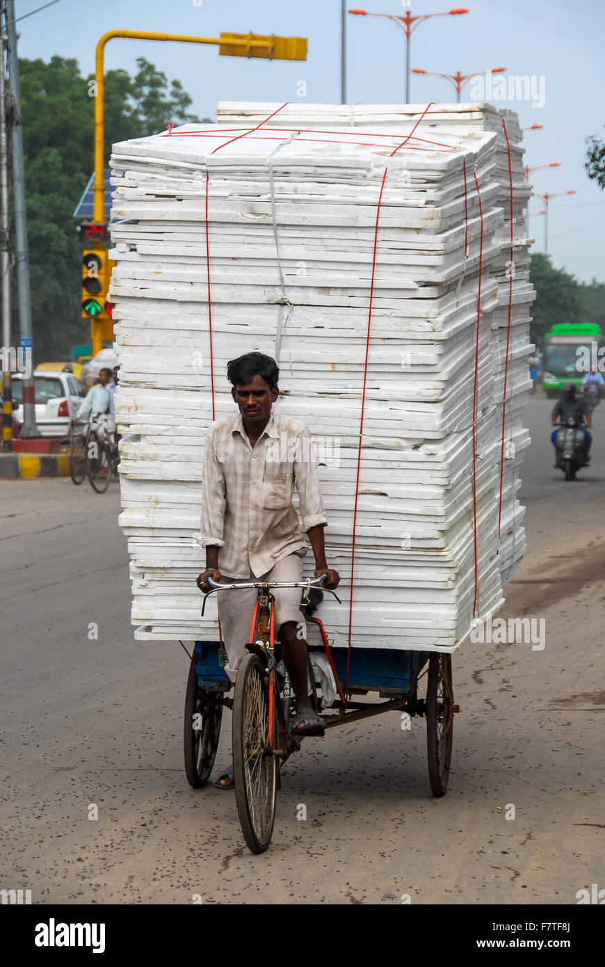 heavy load at rickshaw in new delhi india Stock Photo - Alamy