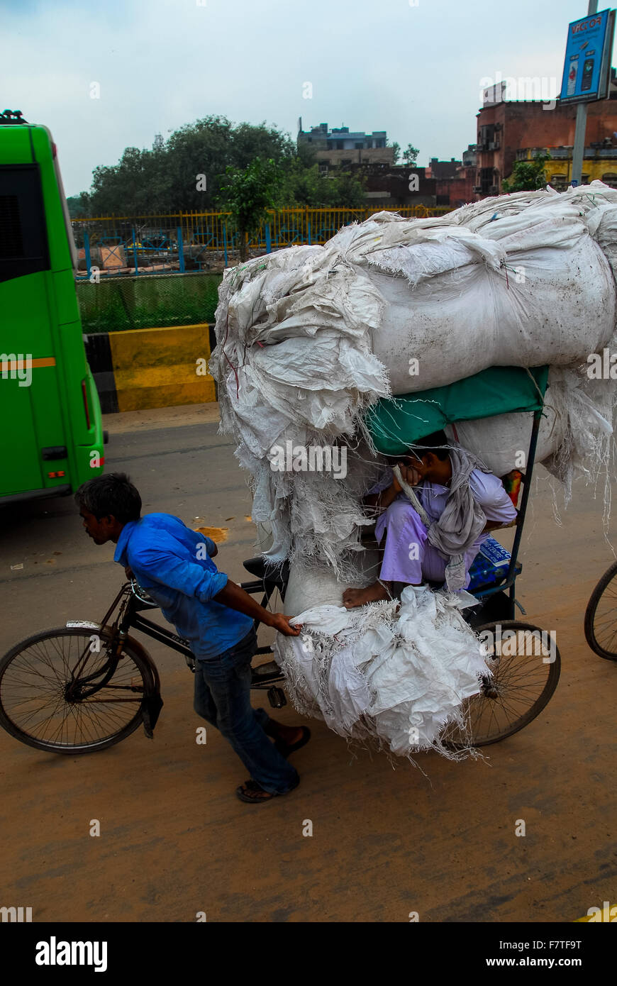 heavy load at rickshaw in new delhi india Stock Photo - Alamy