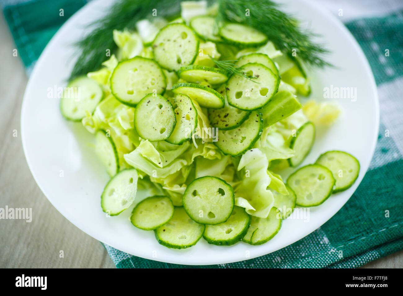 spring salad with cabbage and cucumbers in a plate Stock Photo - Alamy