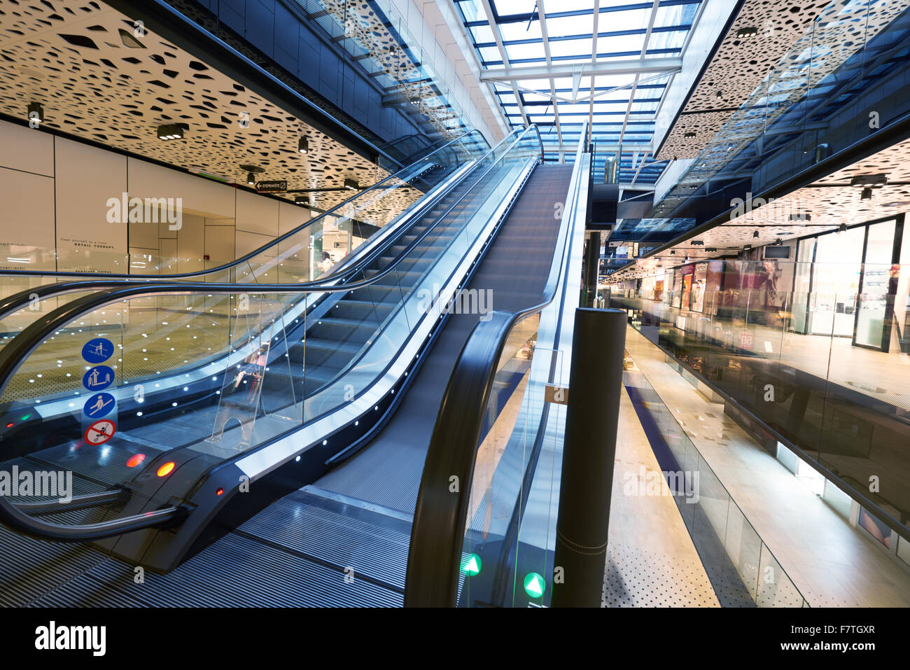 Shopping mall center escalators. Zoom blur movement Stock Photo - Alamy