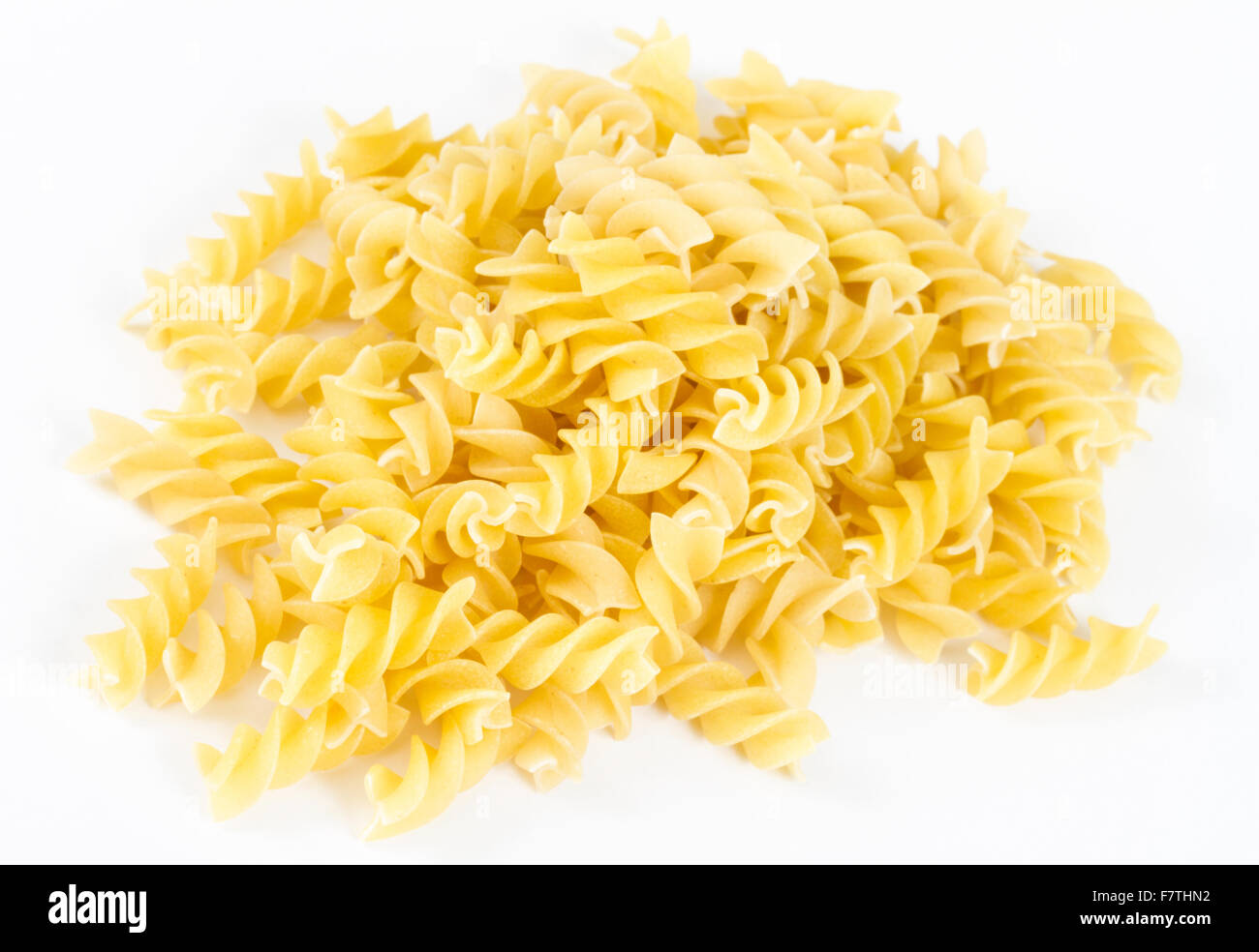 A portion of Rotini corkscrew pasta isolated on white Stock Photo - Alamy