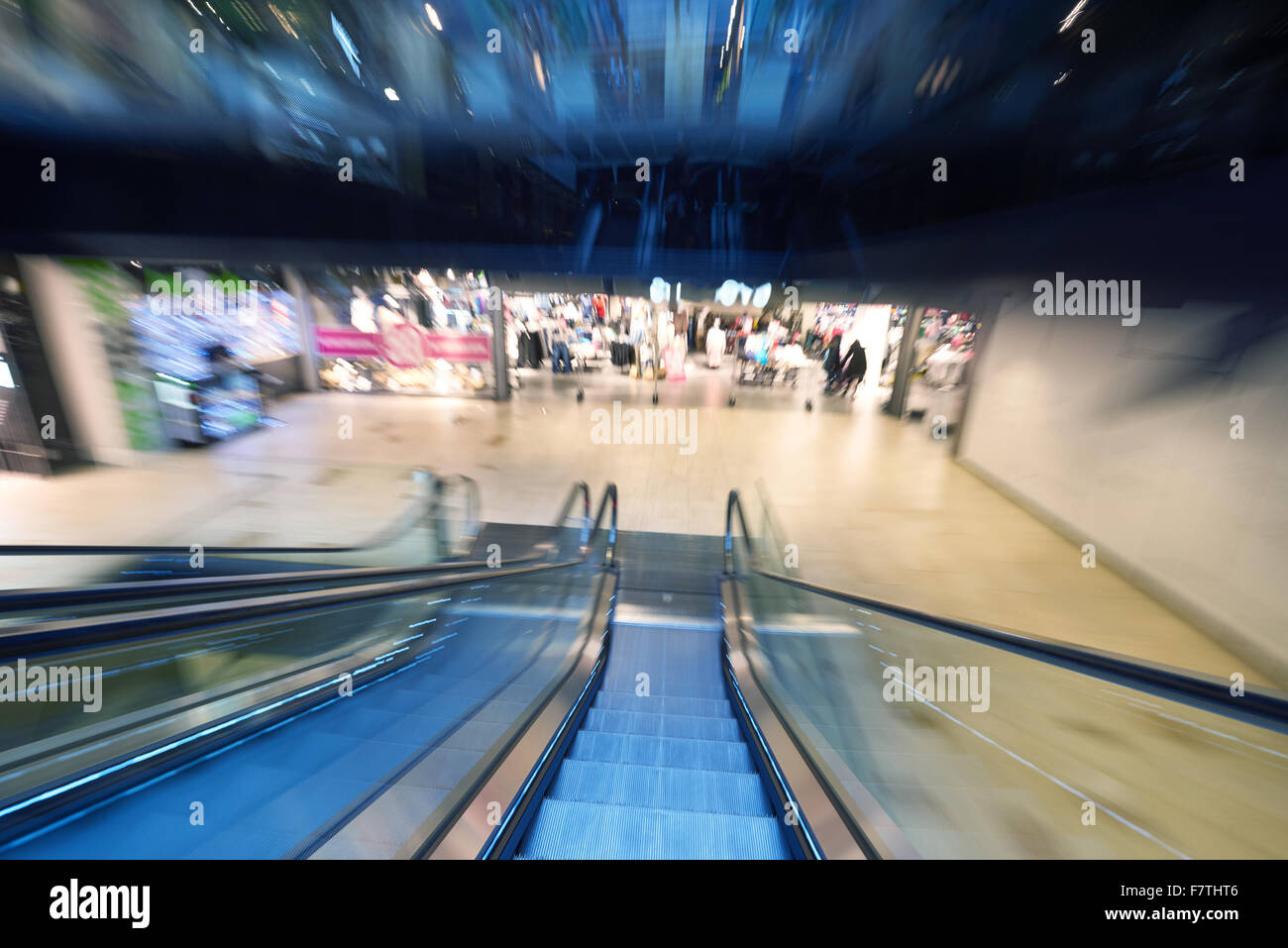 Shopping mall center escalators. Zoom blur movement Stock Photo - Alamy