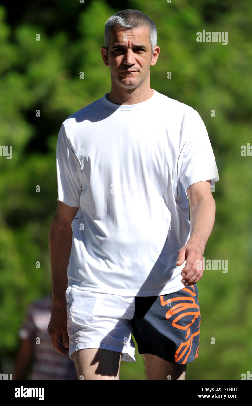 Adult man having walk in shorts Stock Photo - Alamy