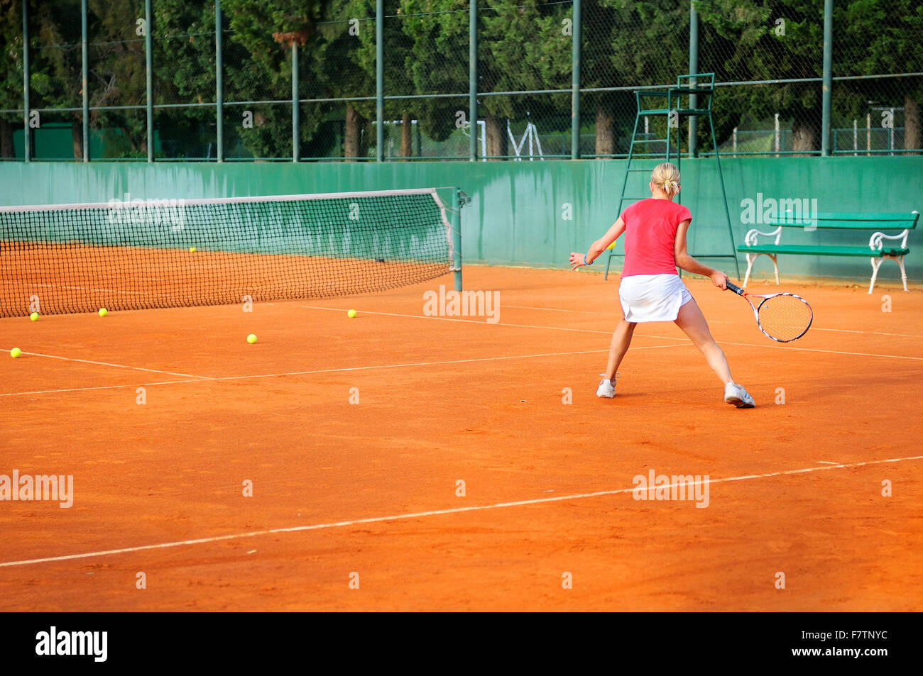 Girl playing tennis outdoor on court Stock Photo - Alamy