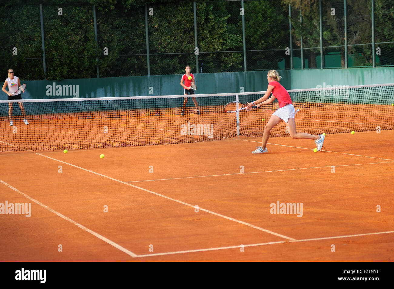 Girl playing tennis outdoor on court Stock Photo - Alamy