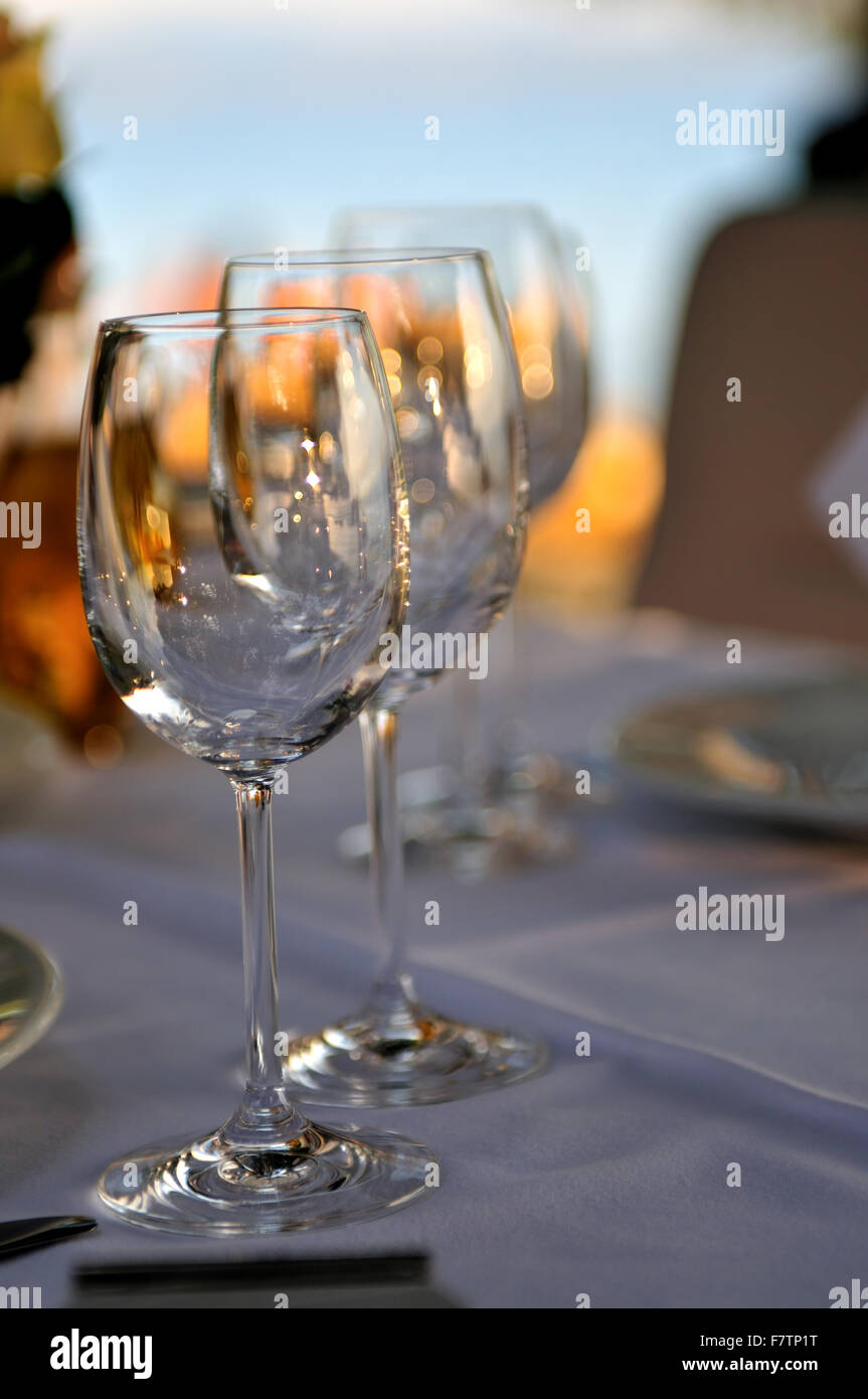 empty vine glasses at outdoor restaurant Stock Photo - Alamy