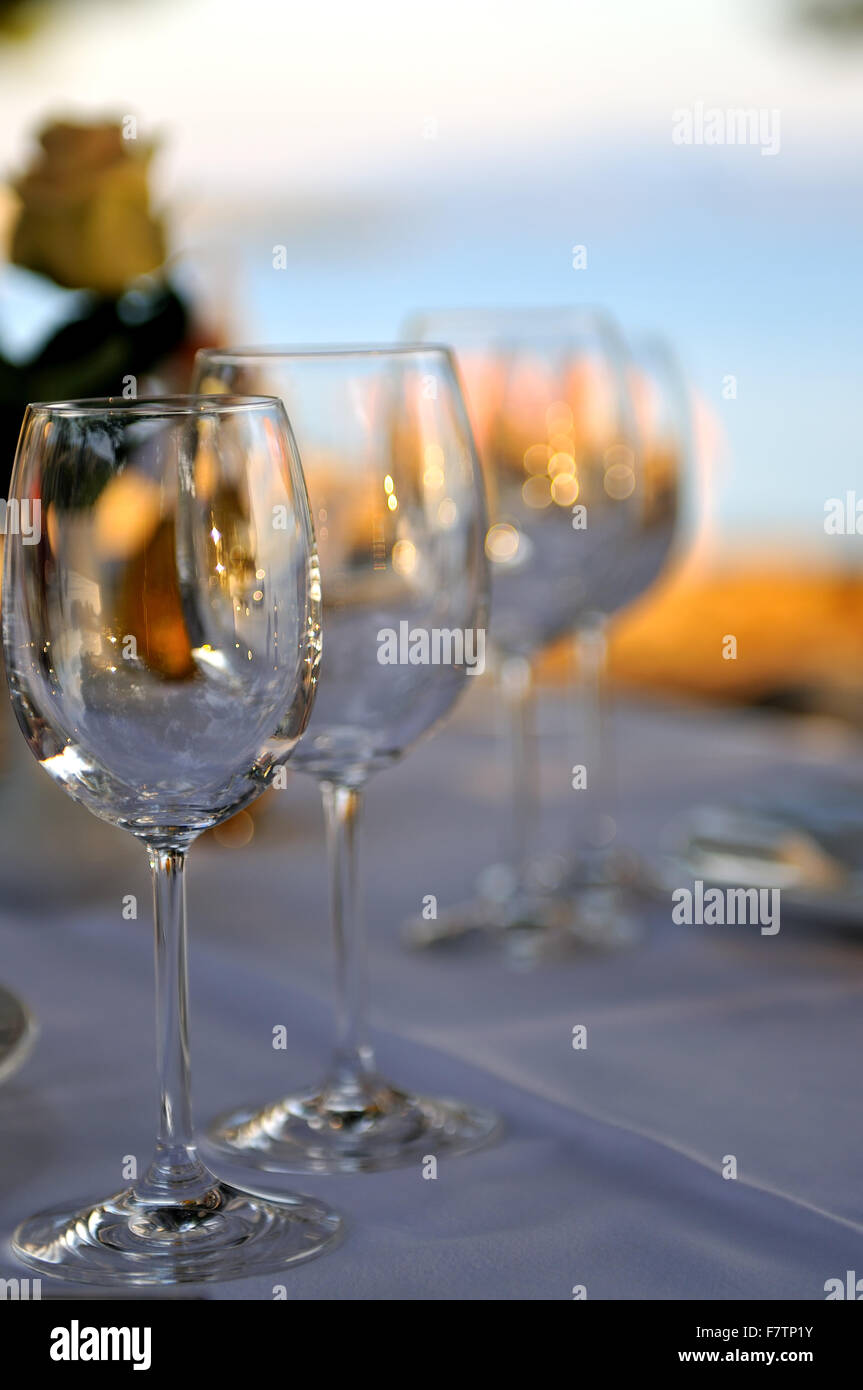 empty vine glasses at outdoor restaurant Stock Photo - Alamy