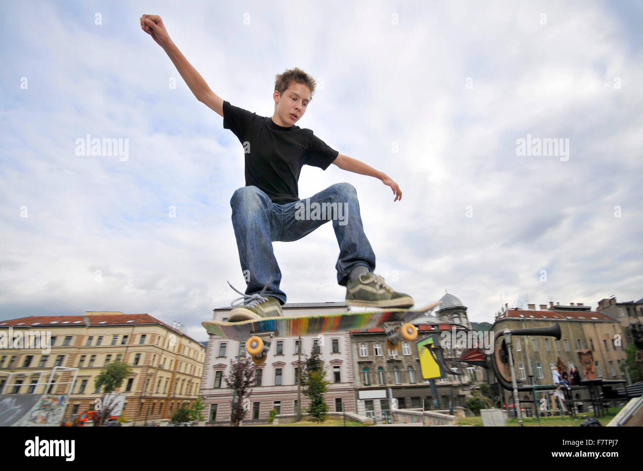 Boy practicing skate in a skate park Stock Photo - Alamy