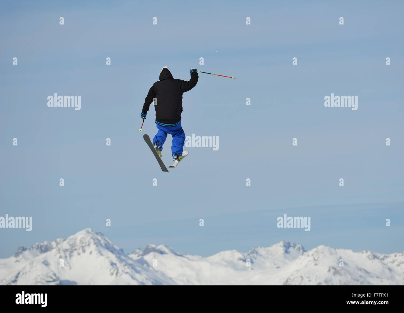 jumping skier at mountain winter snow fresh suny day Stock Photo - Alamy