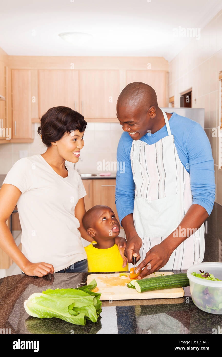 happy African American family of three cooking in home kitchen Stock ...