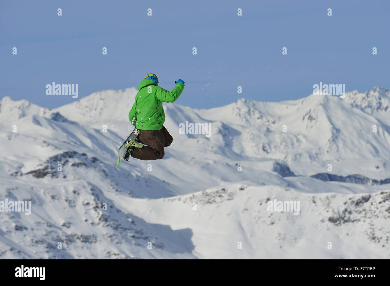 jumping skier at mountain winter snow fresh suny day Stock Photo - Alamy