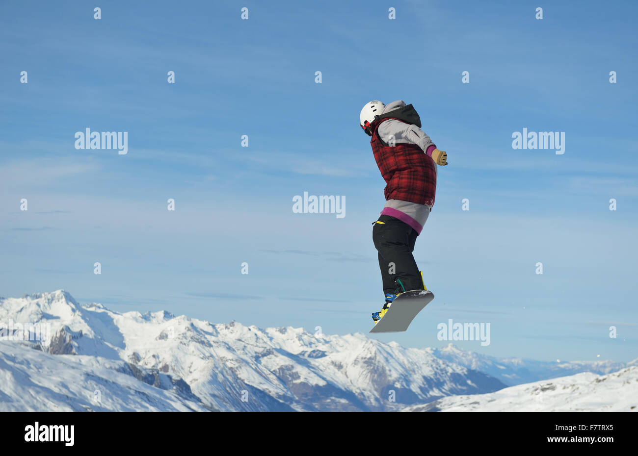 jumping skier at mountain winter snow fresh suny day Stock Photo - Alamy