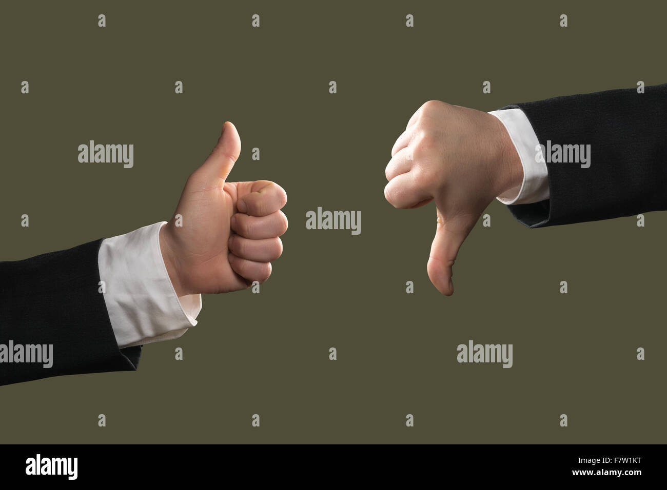 Hands of businessmen shows Thumbs Down and Up Stock Photo - Alamy