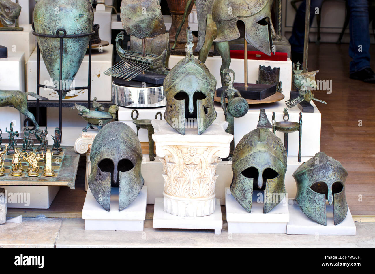 Replicas of Greek antique helmets on sale Stock Photo - Alamy