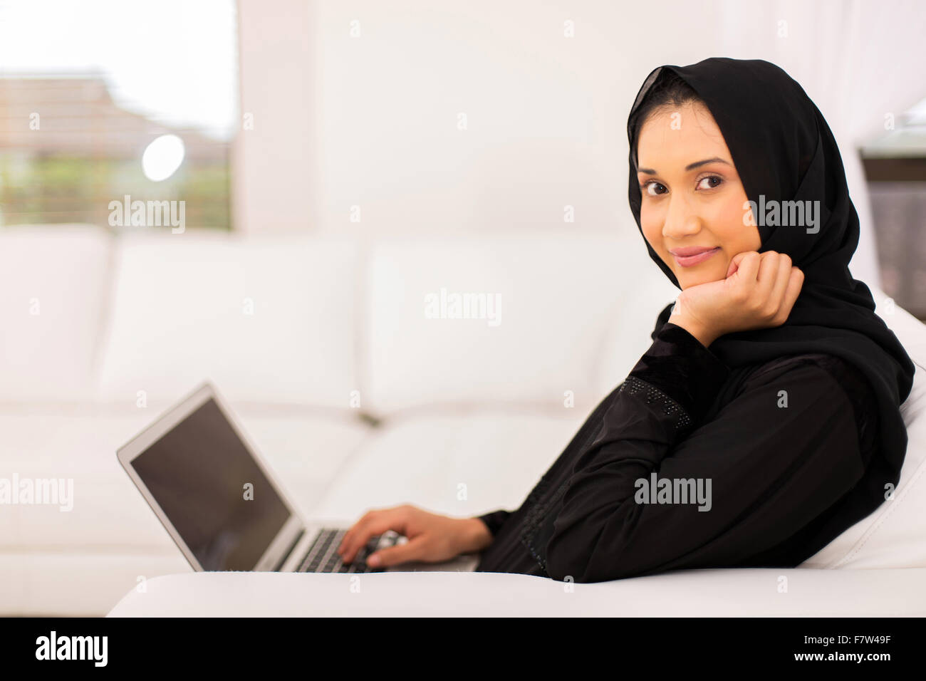 portrait of pretty Arabian woman using laptop Stock Photo - Alamy