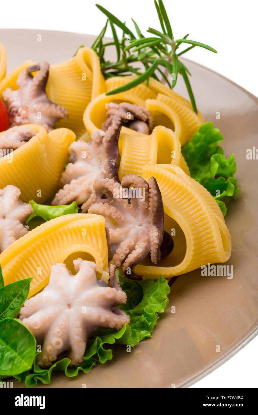 Lumaconi with octopus, cheese and herbs Stock Photo - Alamy