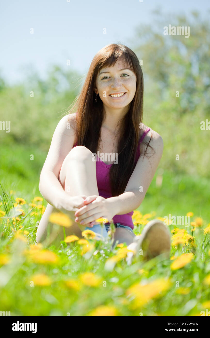 Happy woman relaxing outdoor in grass Stock Photo - Alamy