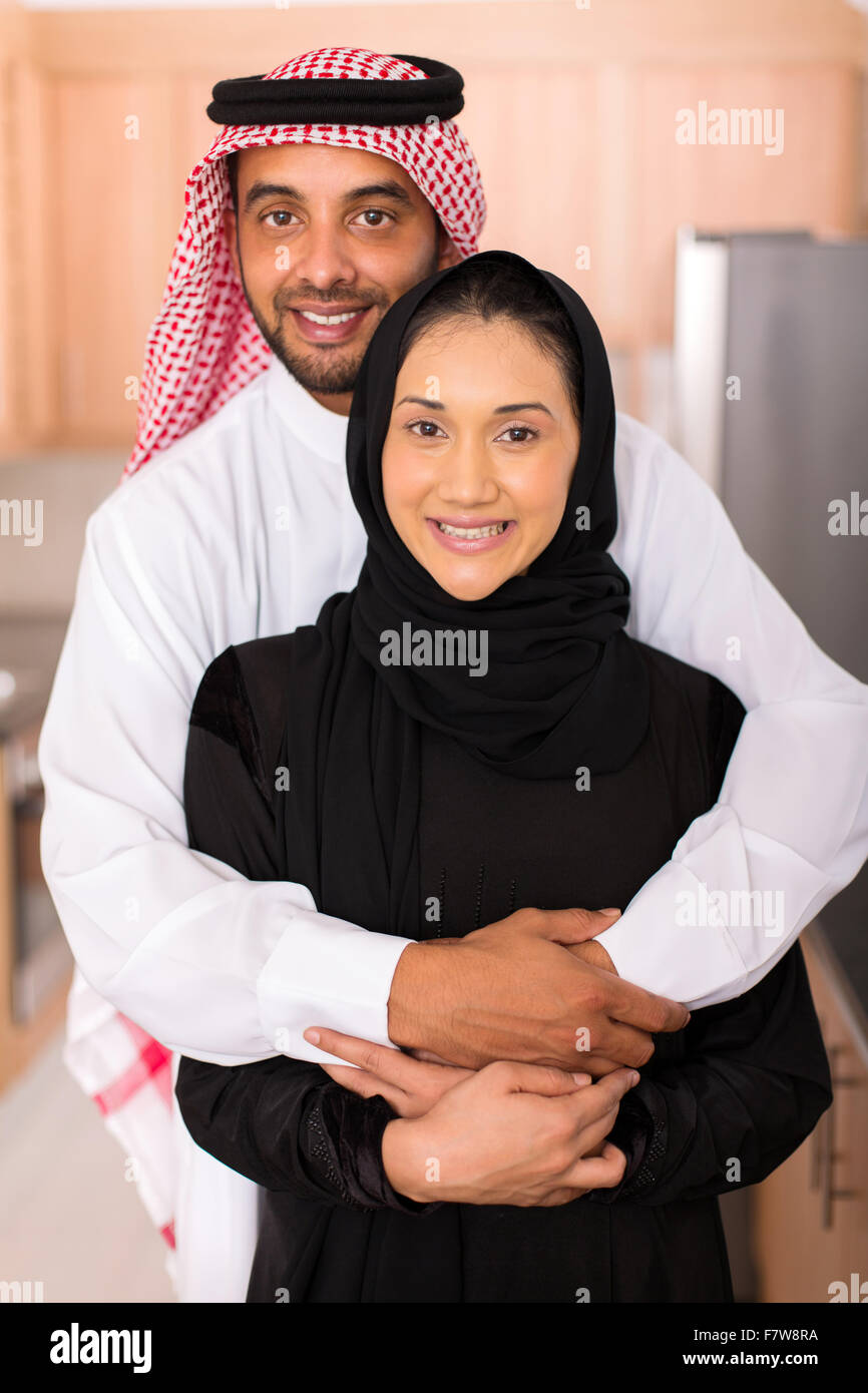 portrait of happy Muslim man hugging his wife Stock Photo - Alamy