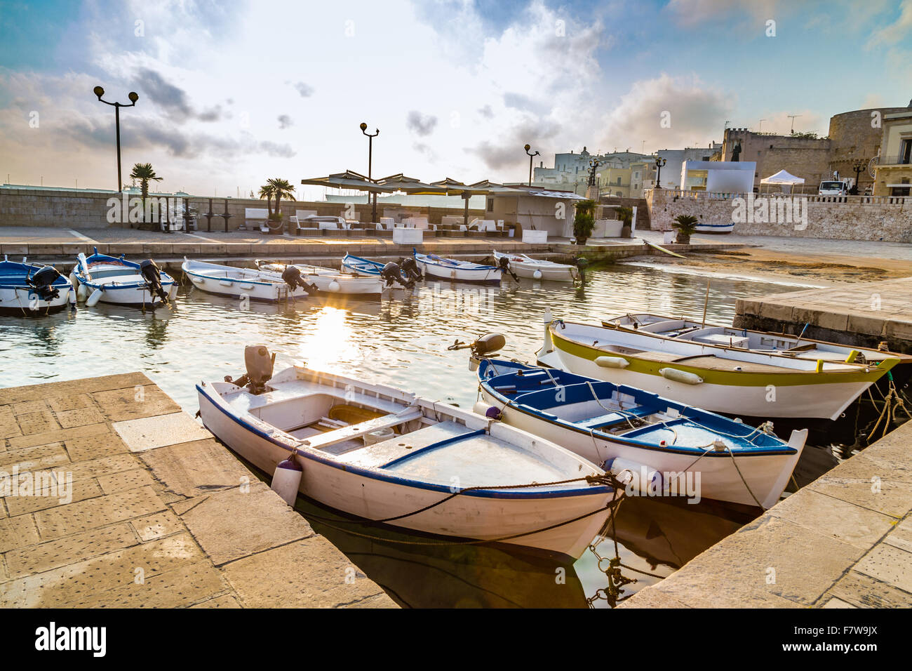 mooring boats in a bay of a medieval city on the Adriatic Sea in Italy ...