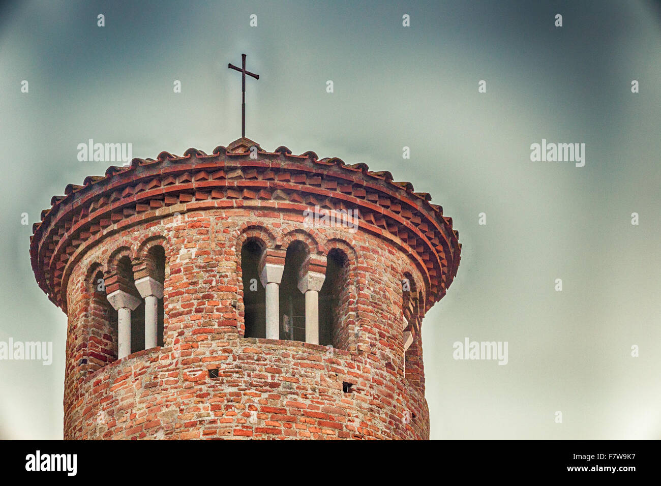 mullioned windows of cylindrical bell tower of the medieval Catholic ...