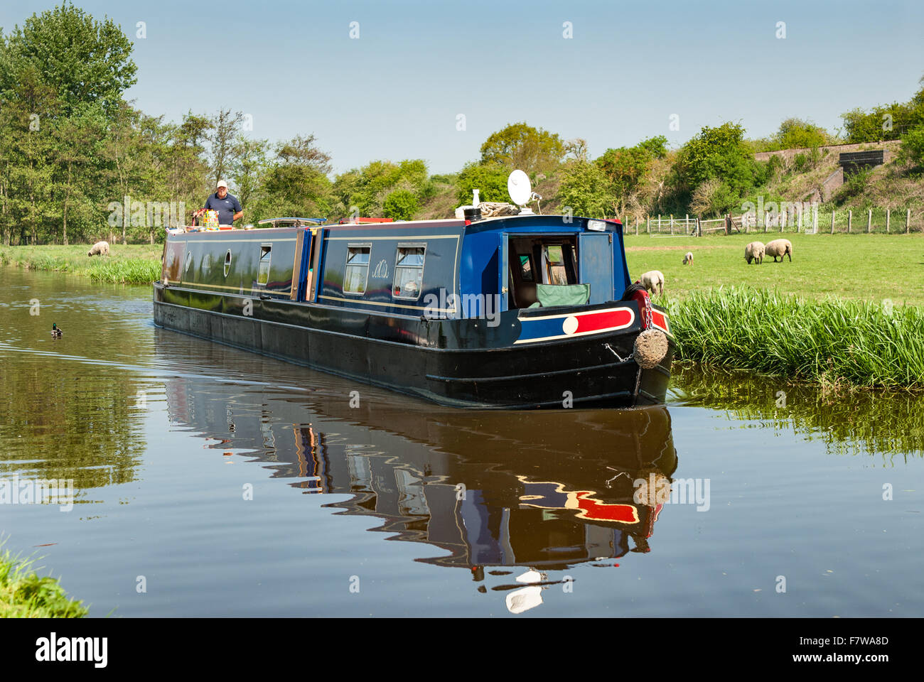Blue narrowboat on the Oxford Canal near Aynho Northamptonshire ...