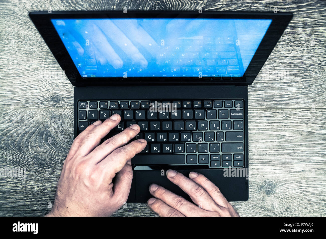 laptop with hands on wood Stock Photo - Alamy