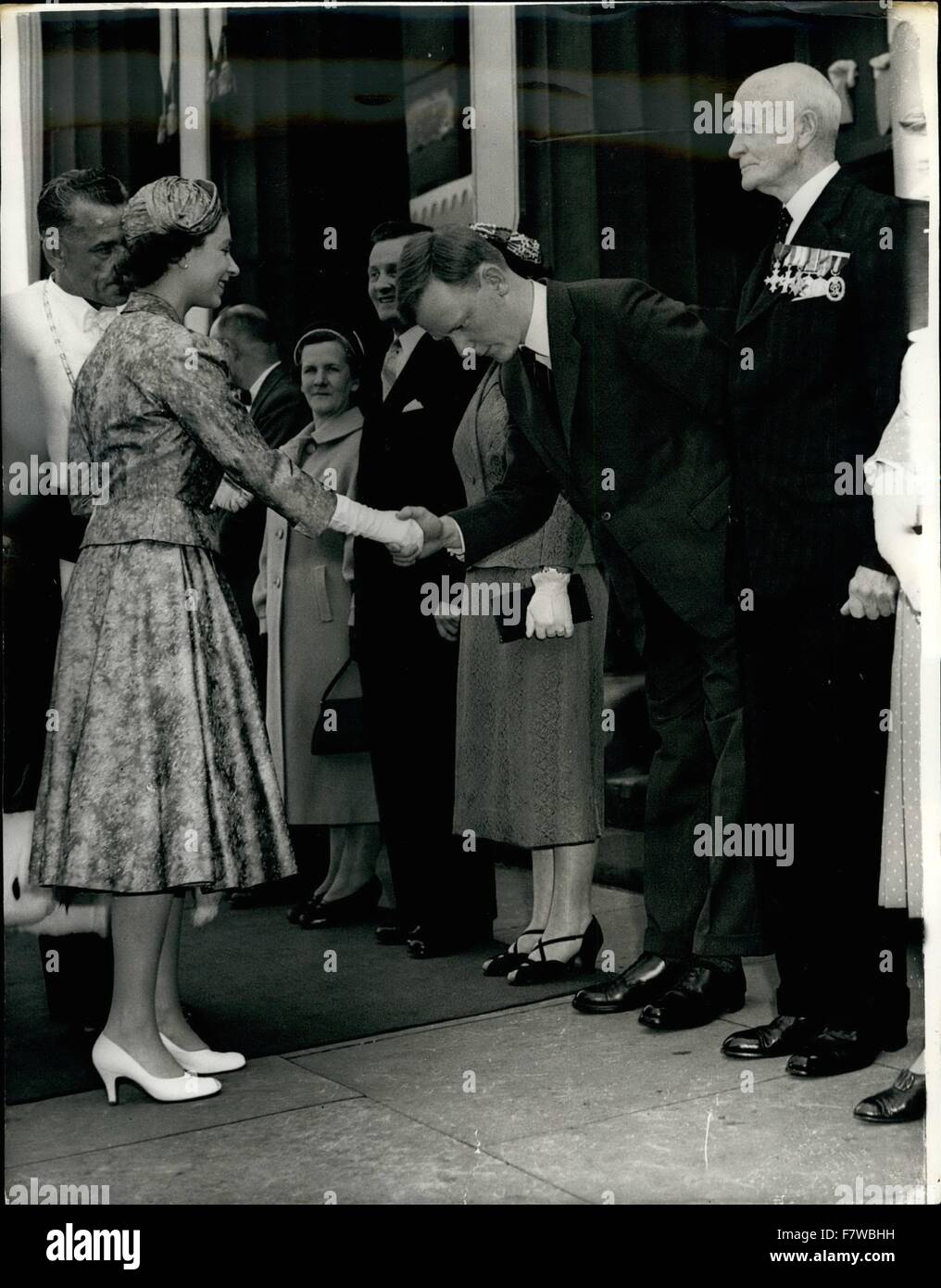 1965 - Queen Visits Port Glasgow: Photo shows H.M. the Queen, shakes hands with the 23-year old ...
